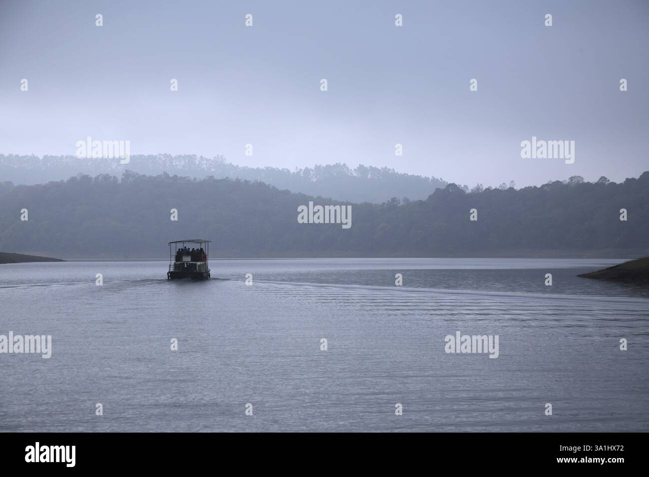 Early morning landscape of Periyar lake tourists on boat ride at ...