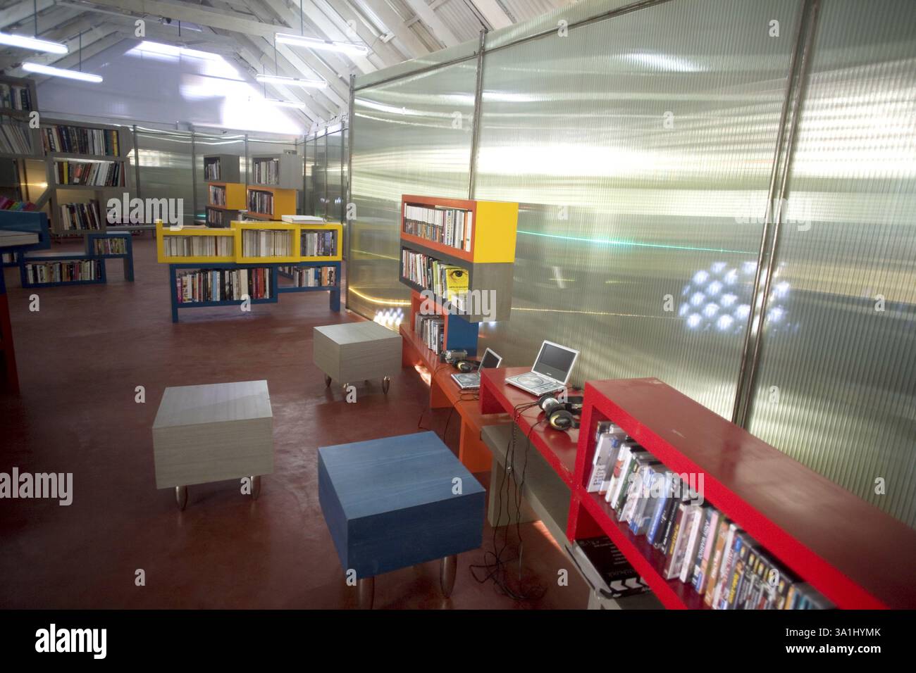 Light colorful pattern on wall and books library Installation by Bose ...
