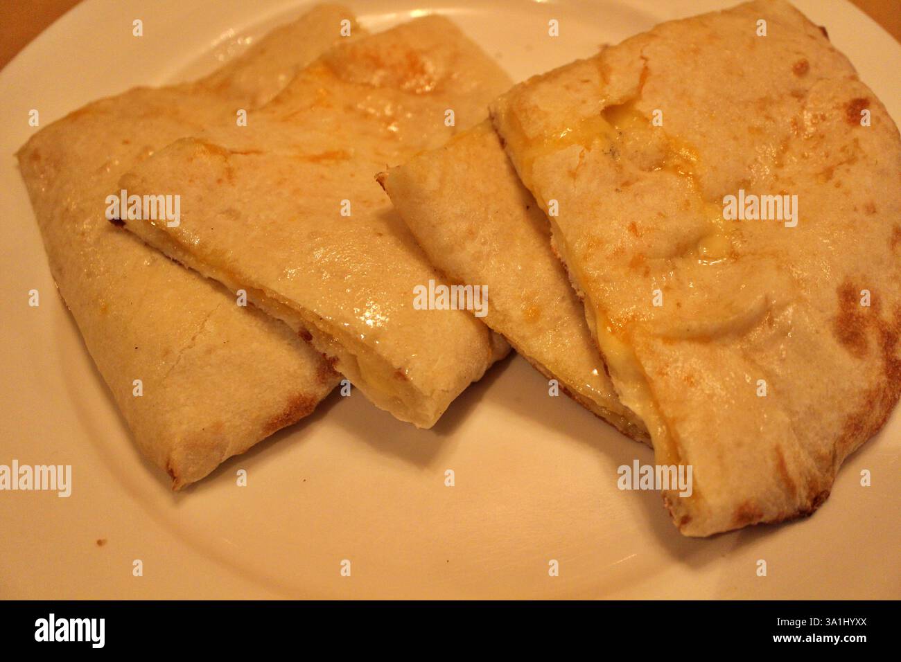 Indian cuisine: cheese naan (cut Stock Photo - Alamy