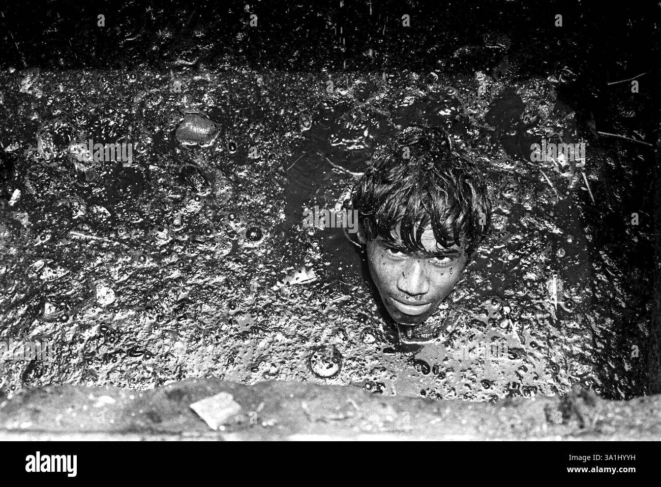 Boy in drainage Stock Photo - Alamy
