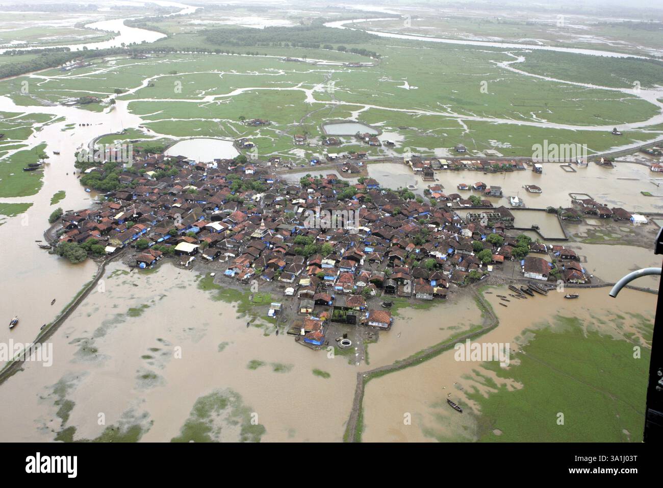 An aerial view of entire village and farming land immersed in water flood rocked in Raigad ...