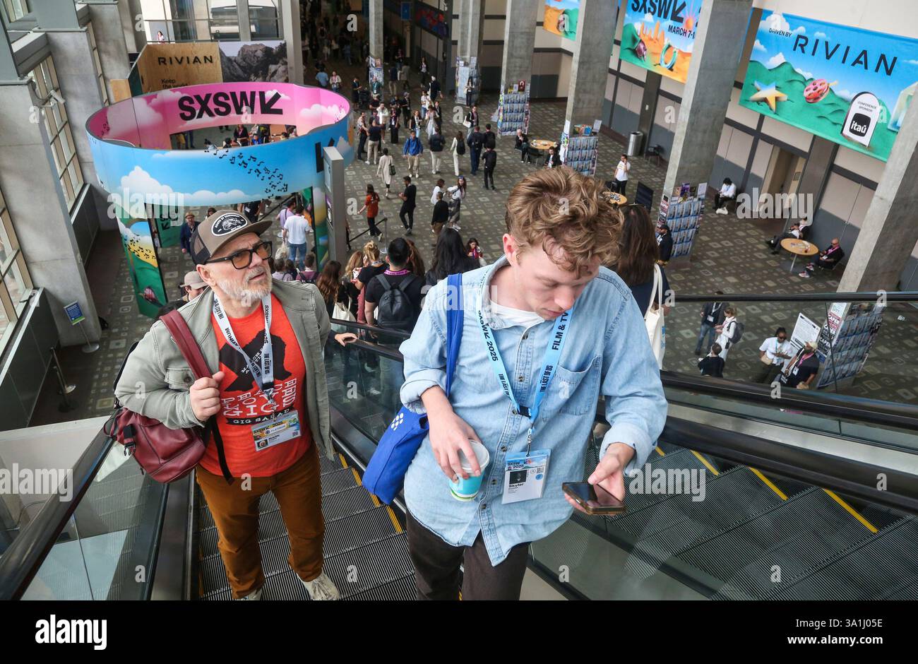 Skyler Knutzen, right, and Mark Steiner ride an escalator while ...