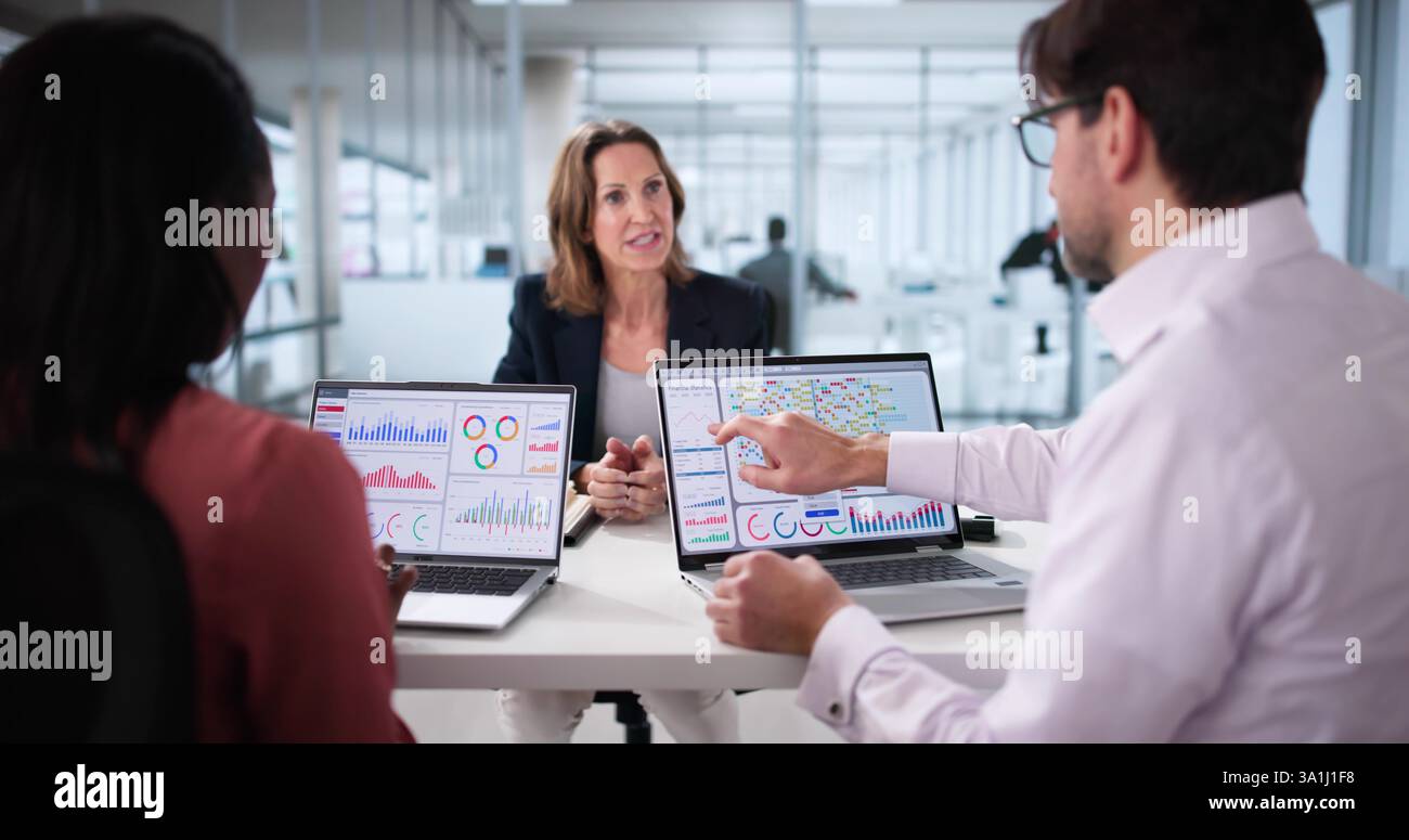 Analyzing data on analytics dashboard during multicultural team meeting ...
