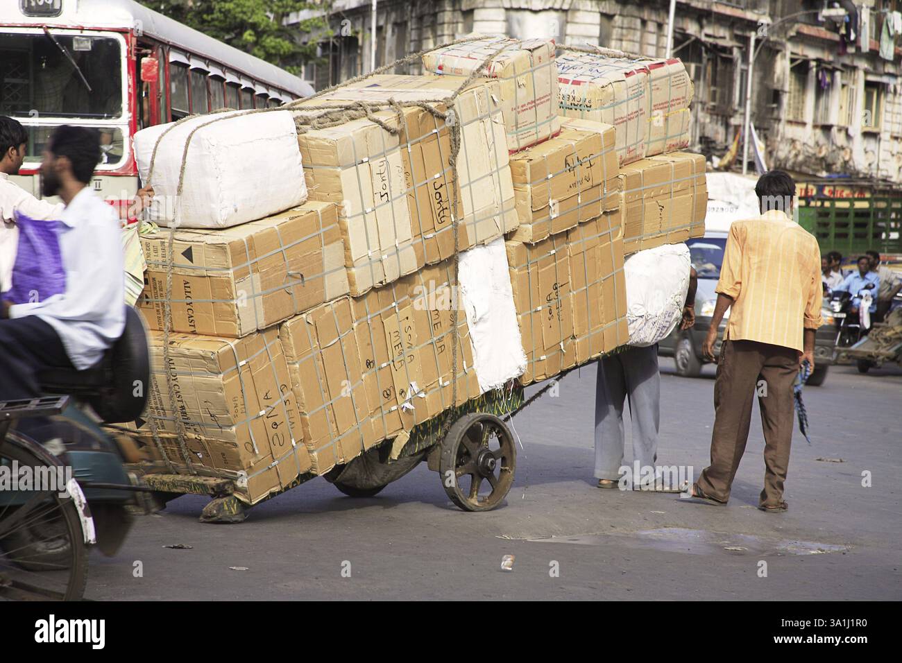 Man pulling hand cart, Sardar Vallabhbhai Patel road, Grant road ...