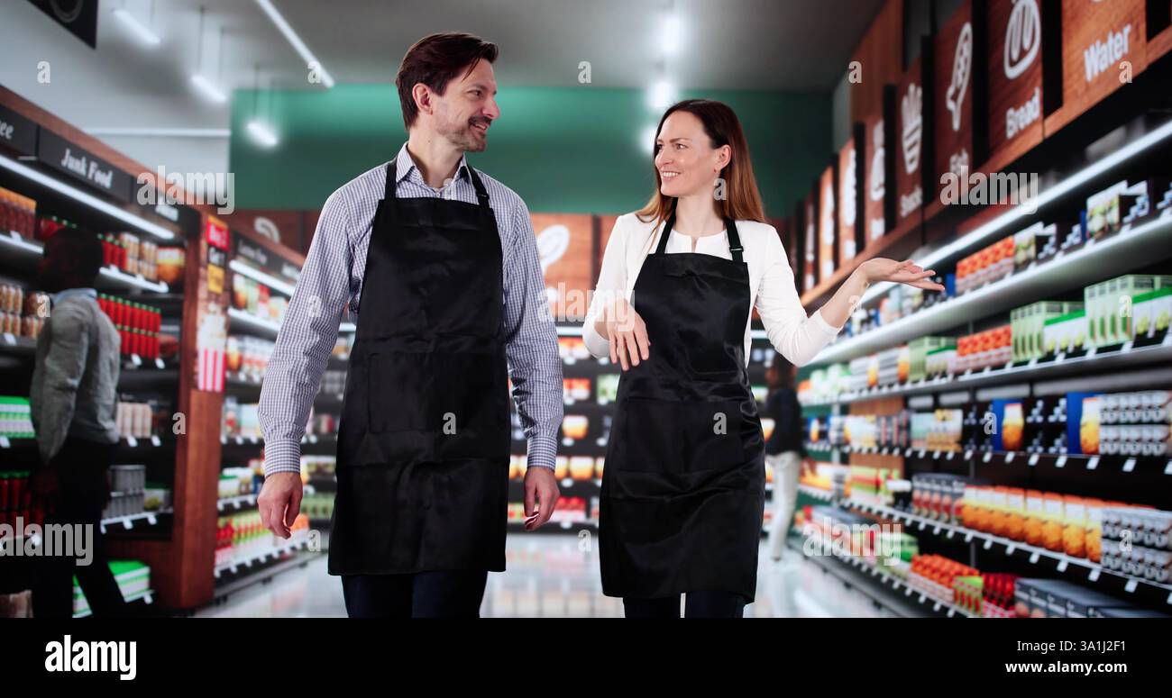 Teaching a Woman the Ropes at the Retail Supermarket Assistant Stock ...