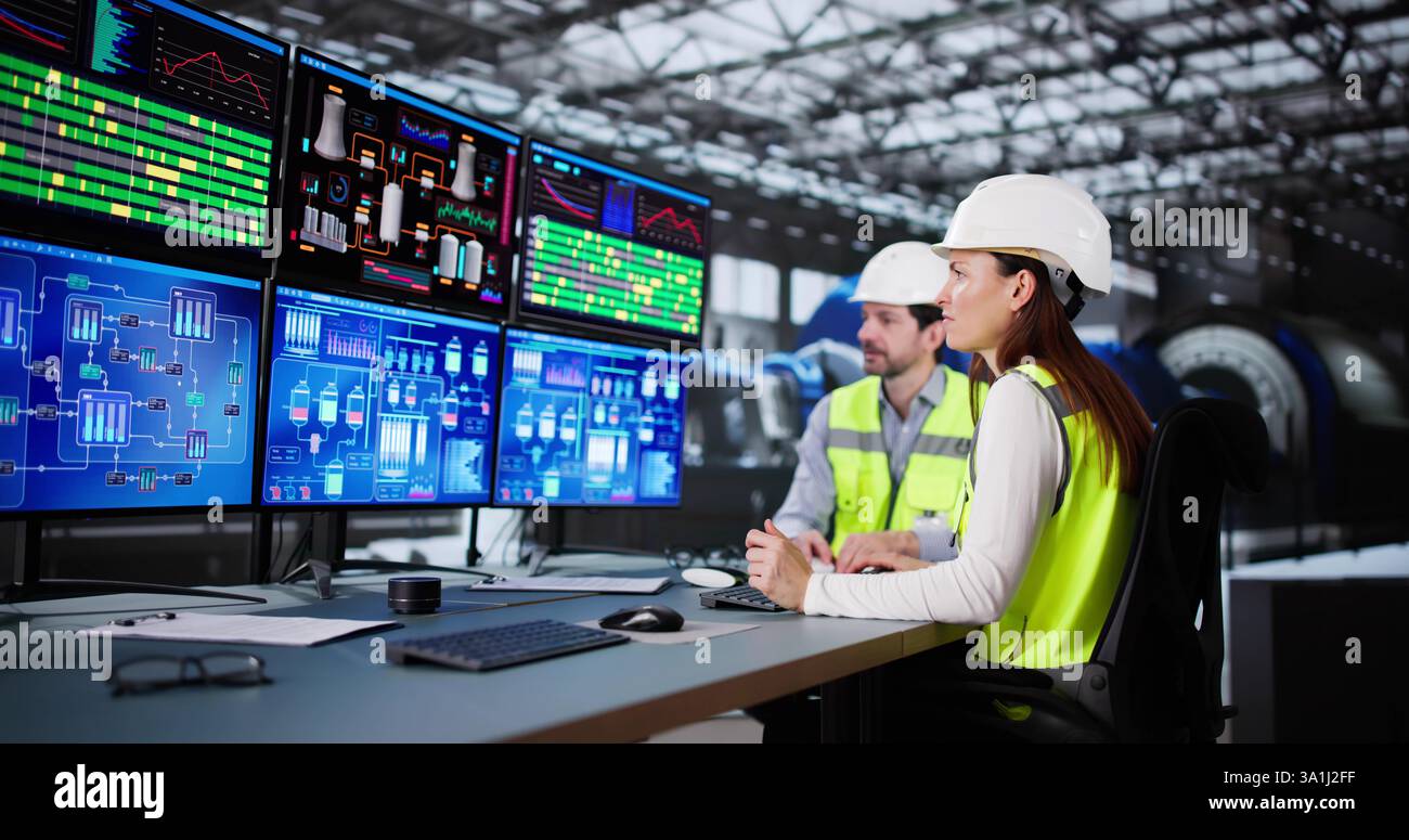 Man controlling electricity generation in power plant using SCADA ...