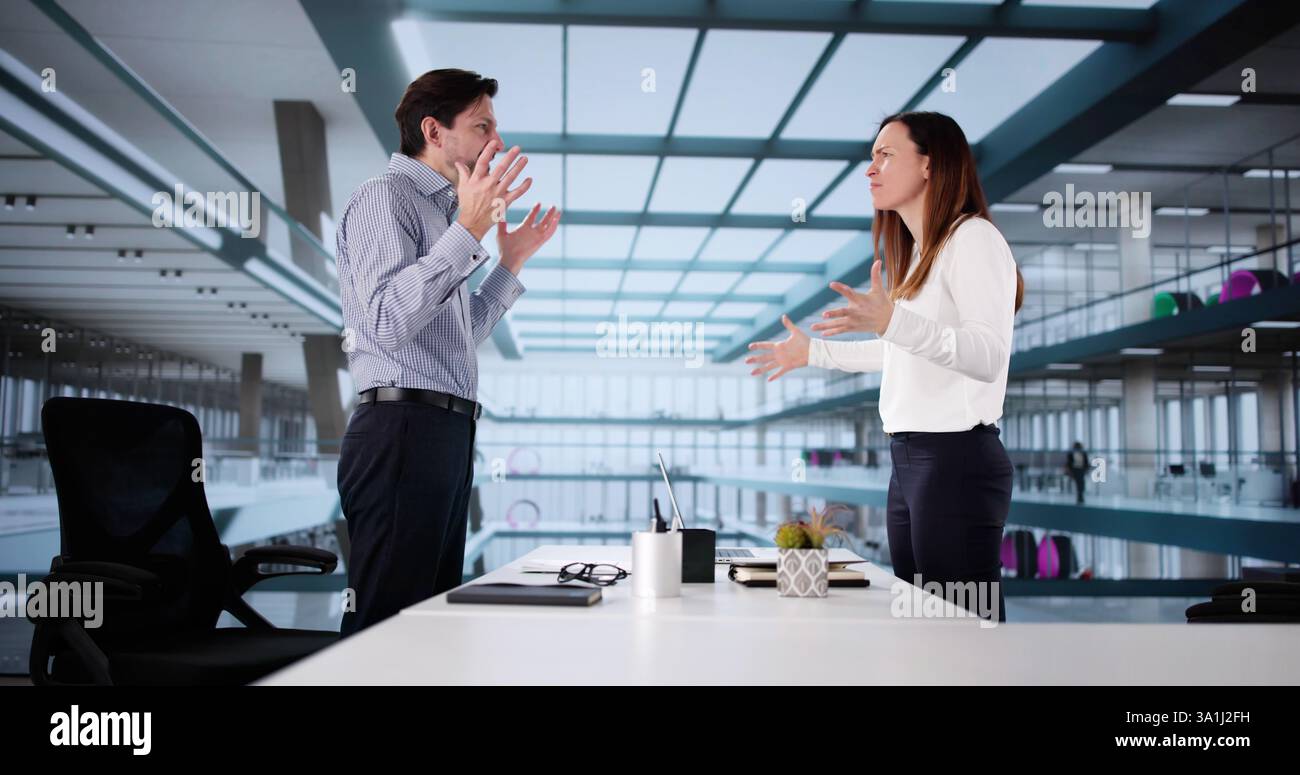Office Conflict: A Man and Woman Argue at Their Desks Stock Photo - Alamy