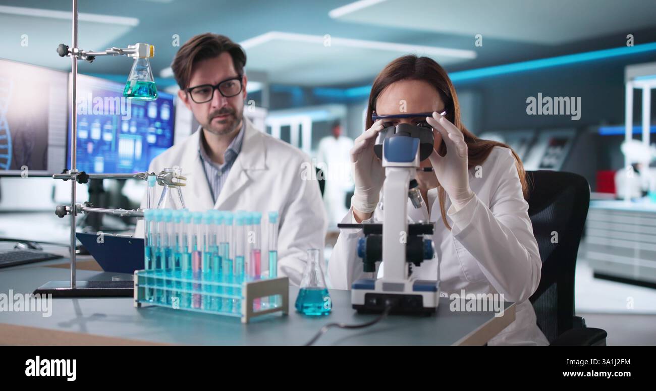 Researcher Couple Analyzing Data in High-Tech Science Lab Setting Stock ...