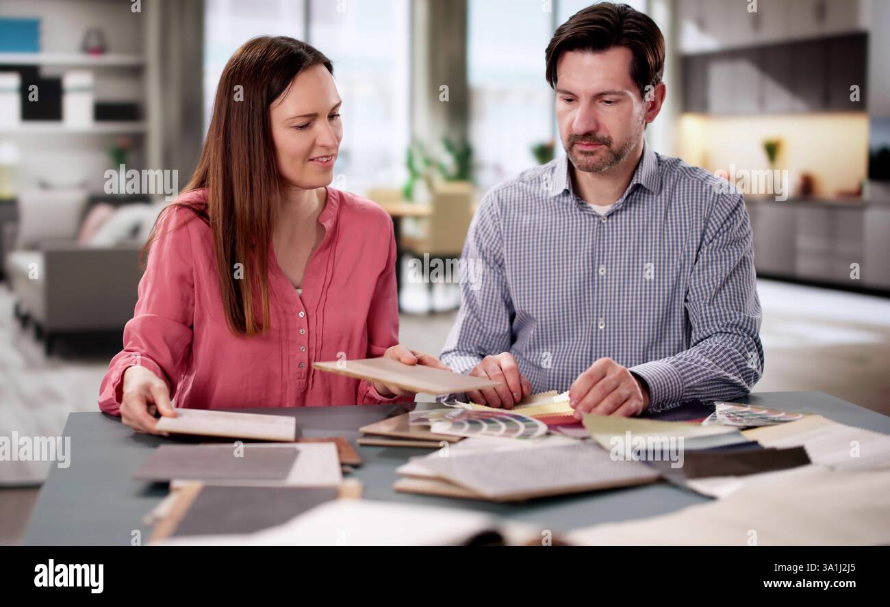 Couple Selecting Paint Colors for New Home Interior Design Project ...