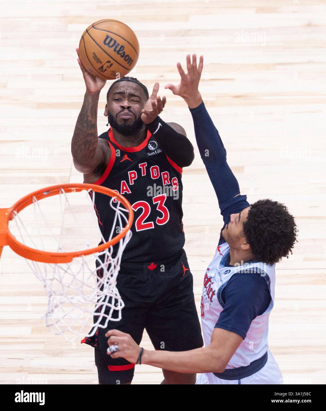 Toronto, Canada. 8th Mar, 2025. Jamal Shead (L) of Toronto Raptors ...