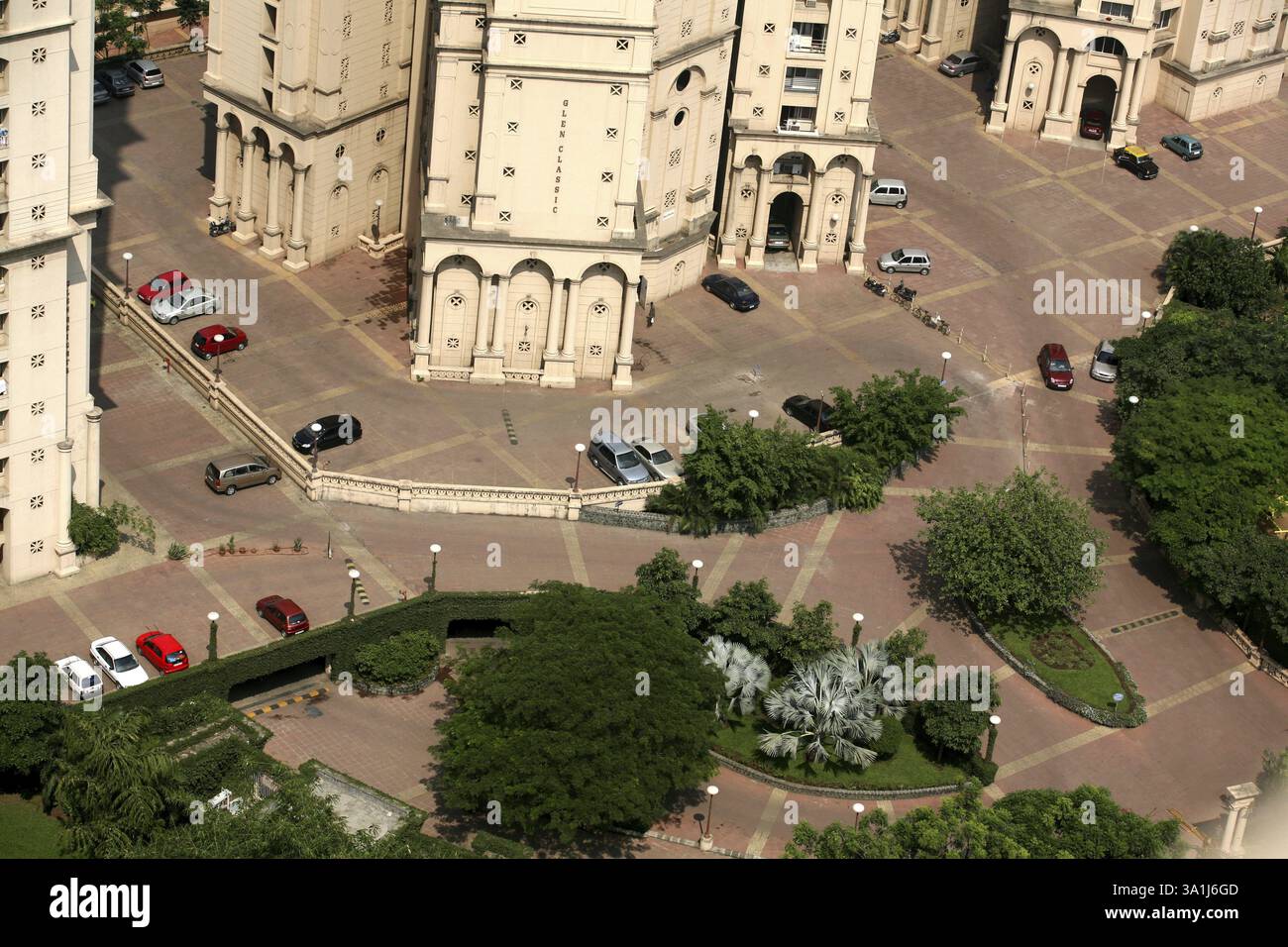 Aerial view of parking lots of high rise buildings with car in ...