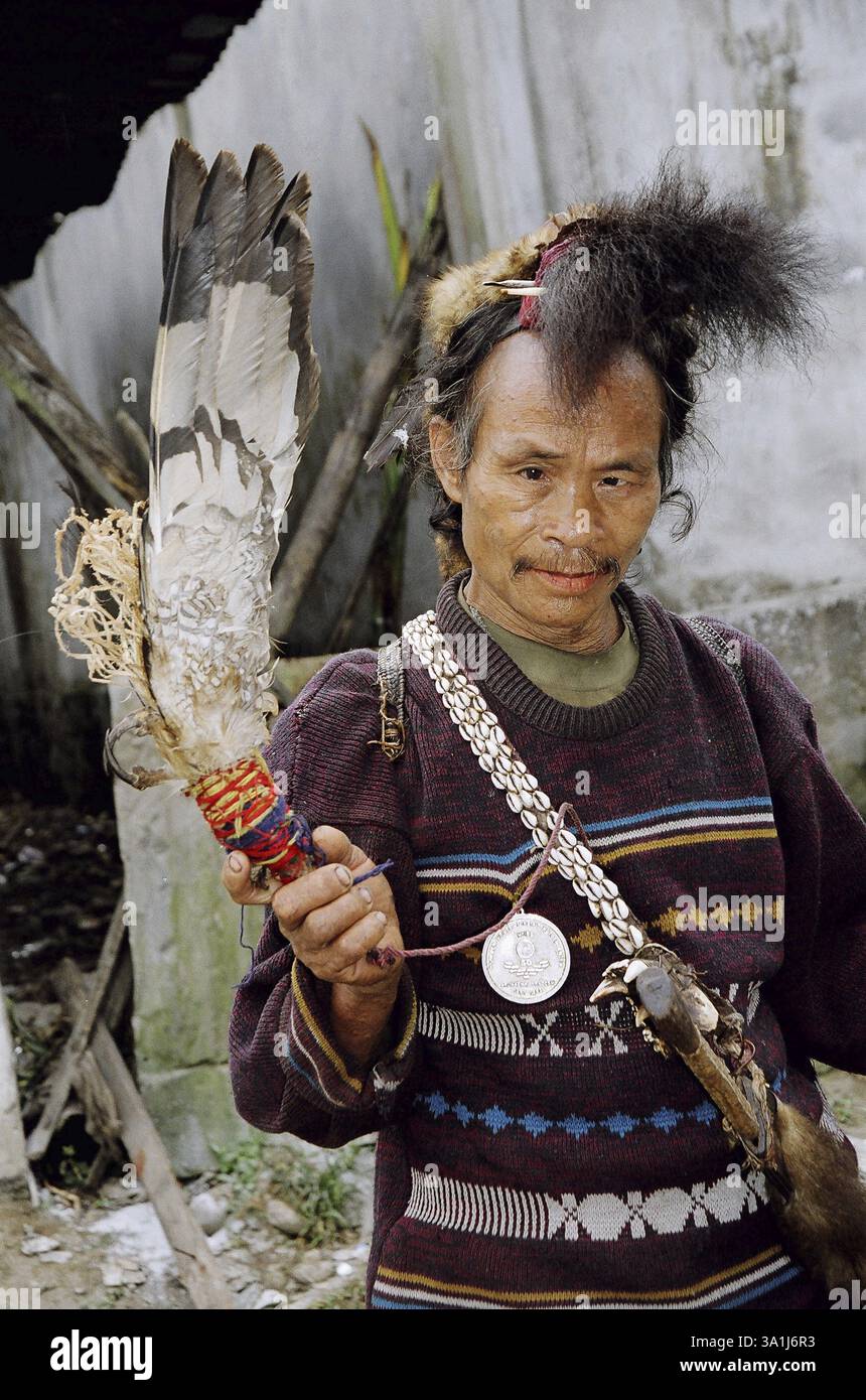 Rural man holding feathers, India, Asia Stock Photo - Alamy