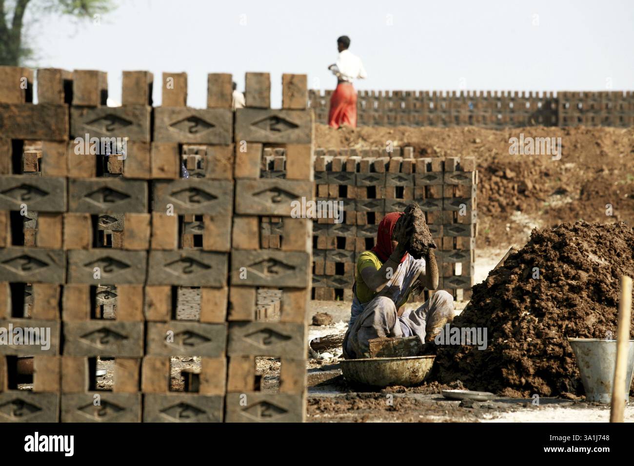 A woman brick maker at the brick factory in a village of Sangli ...