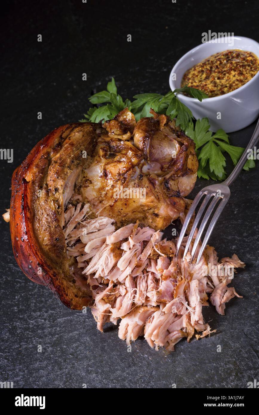 Fresh roasted knuckle of pork with mustard Stock Photo - Alamy
