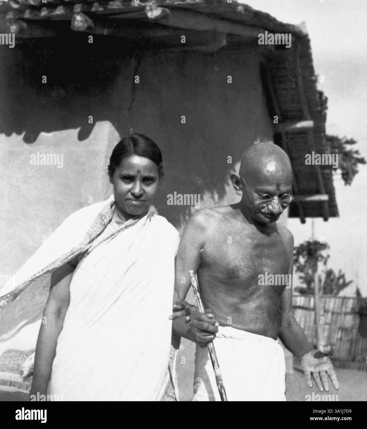 Mahatma Gandhi and Premabehn Kantak in front of his hut at Sevagram ...