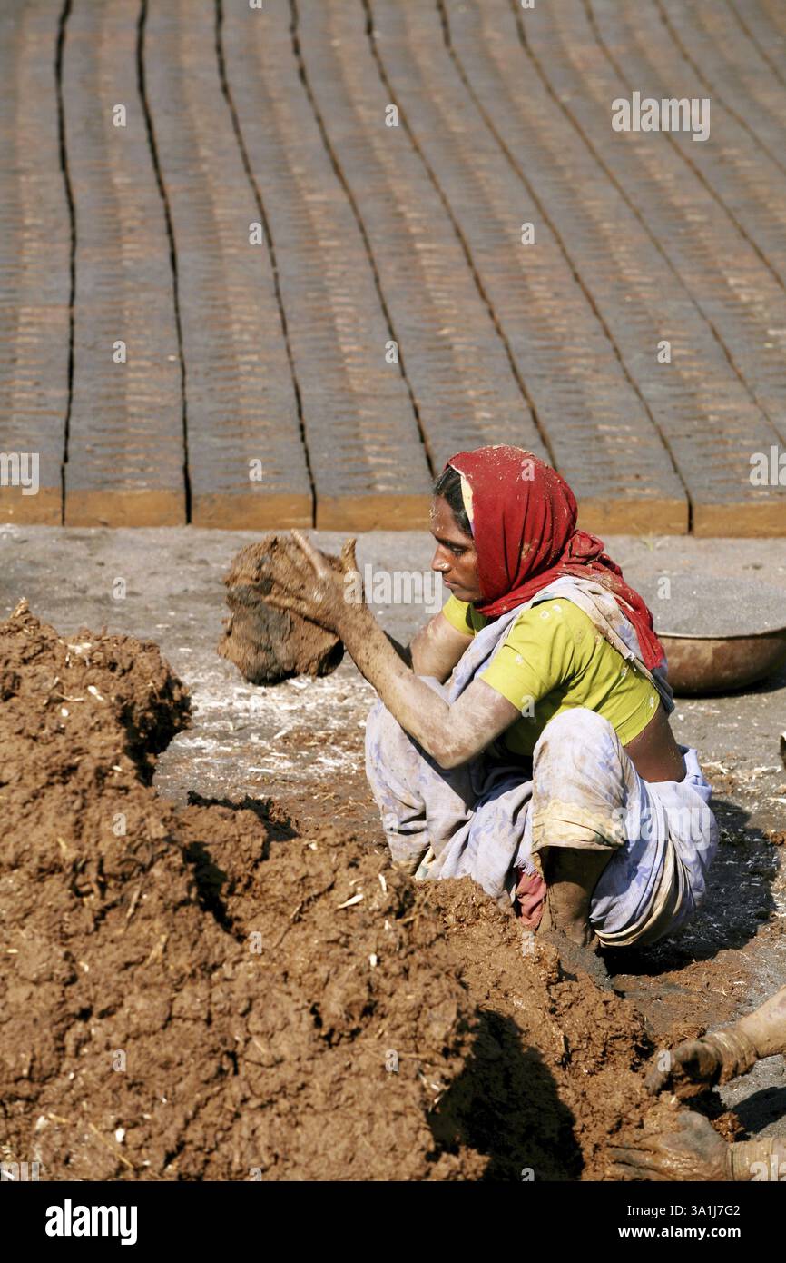 A woman brick maker at the brick factory in a village of Sangli ...