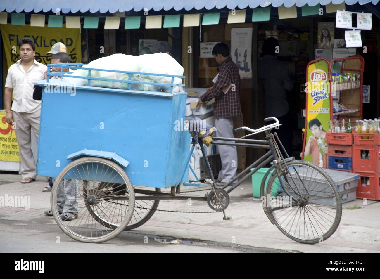 Blue color three wheeler rickshaw for goods transportation, Street ...