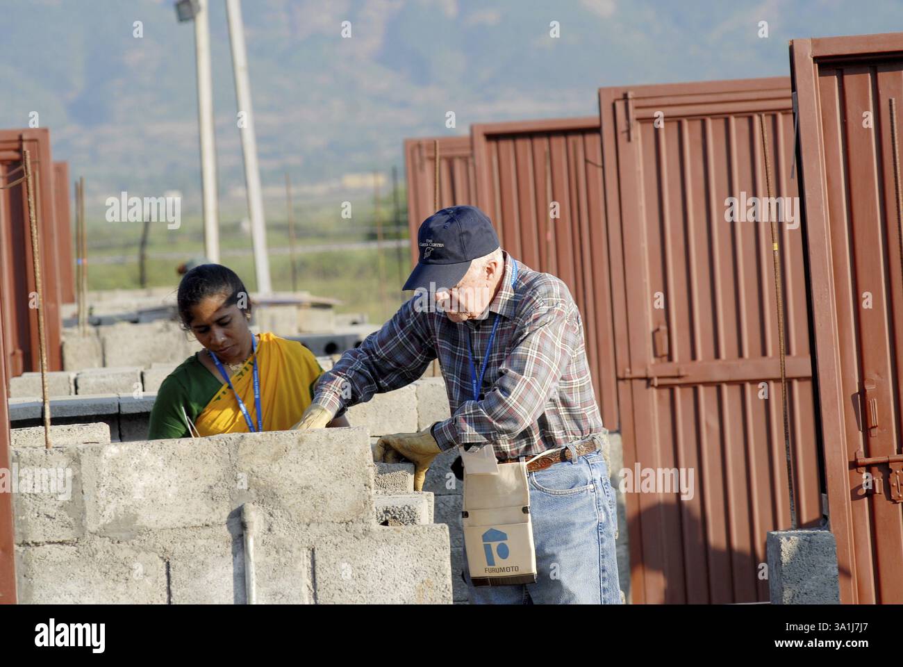 Former US president Jimmy Carter along with volunteers build houses at ...