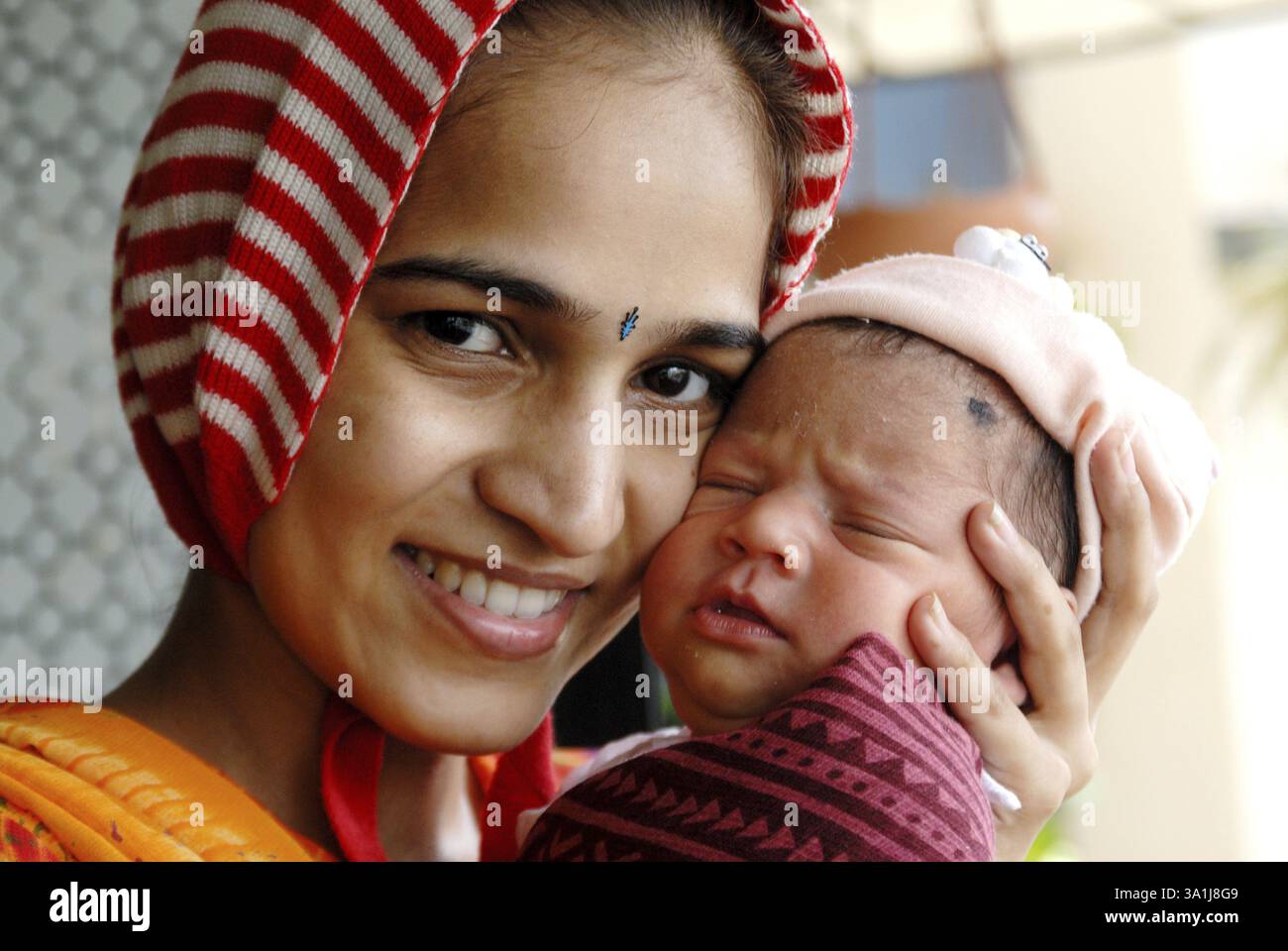South Asian Indian newly born baby with mother, Bombay Mumbai ...