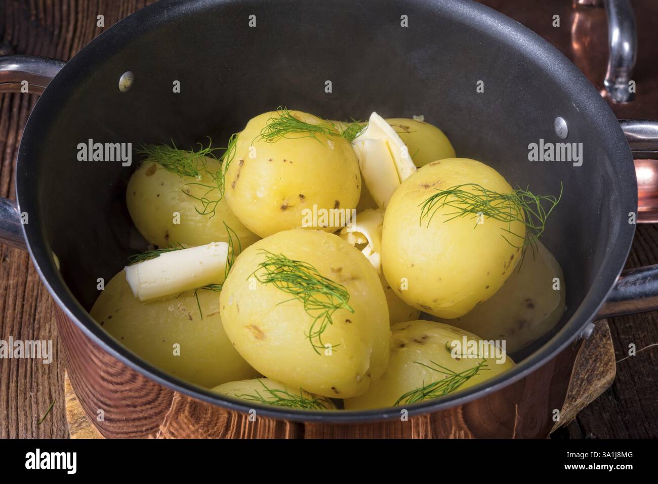 Fresh boiled young potatoes with butter Stock Photo - Alamy