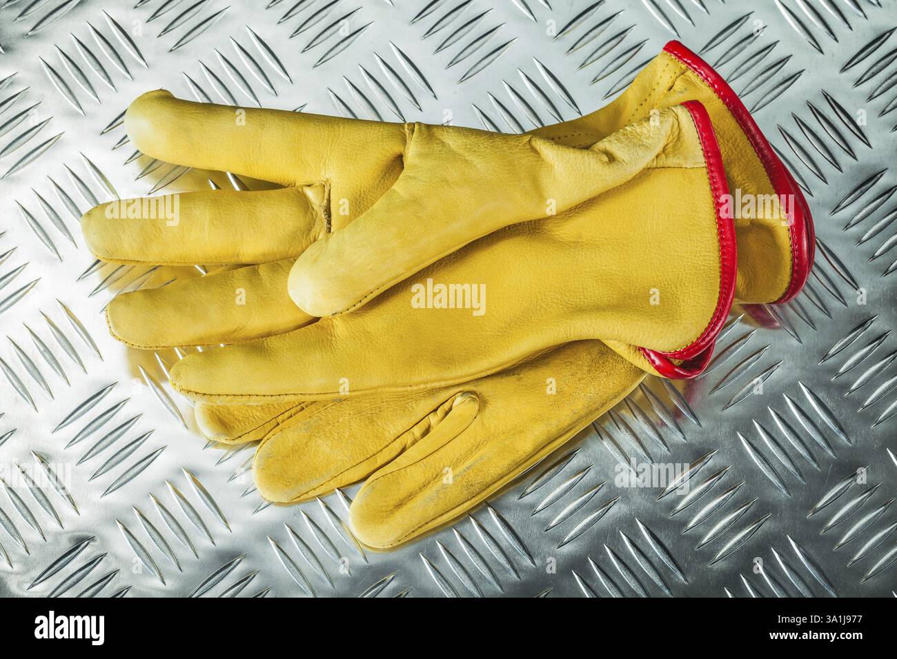 Leather protective gloves on corrugated metal texture Stock Photo - Alamy