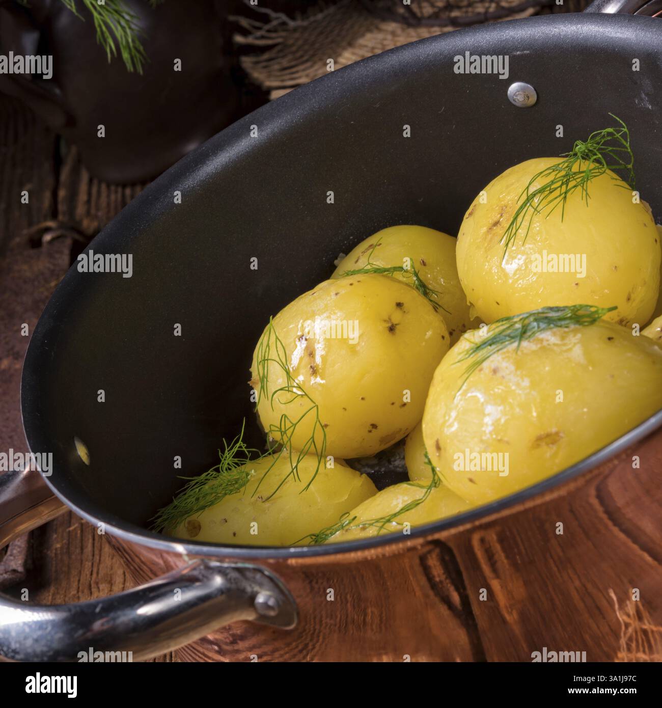 Fresh boiled young potatoes with butter Stock Photo - Alamy