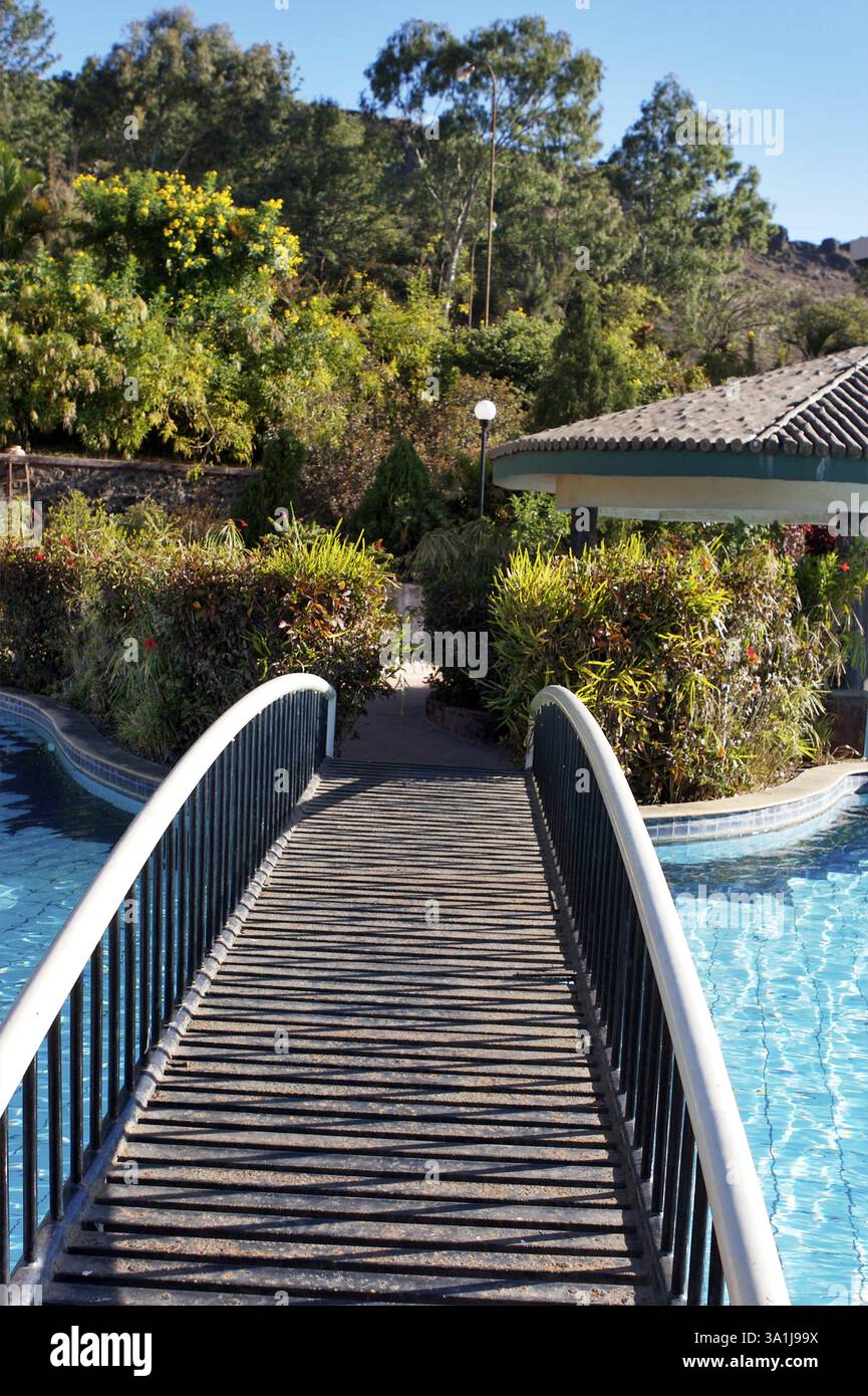 Bridge across swimming pool at a resort at Panchgani, Maharashtra ...