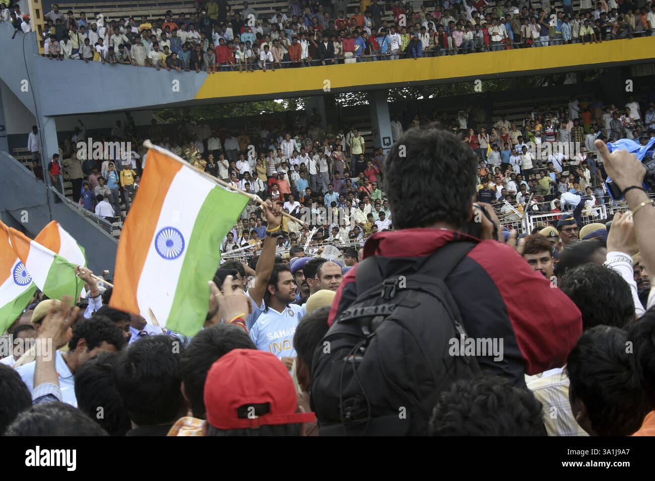 Cricket fans wave tri color Indian flag at Wankhede Stadium during ...