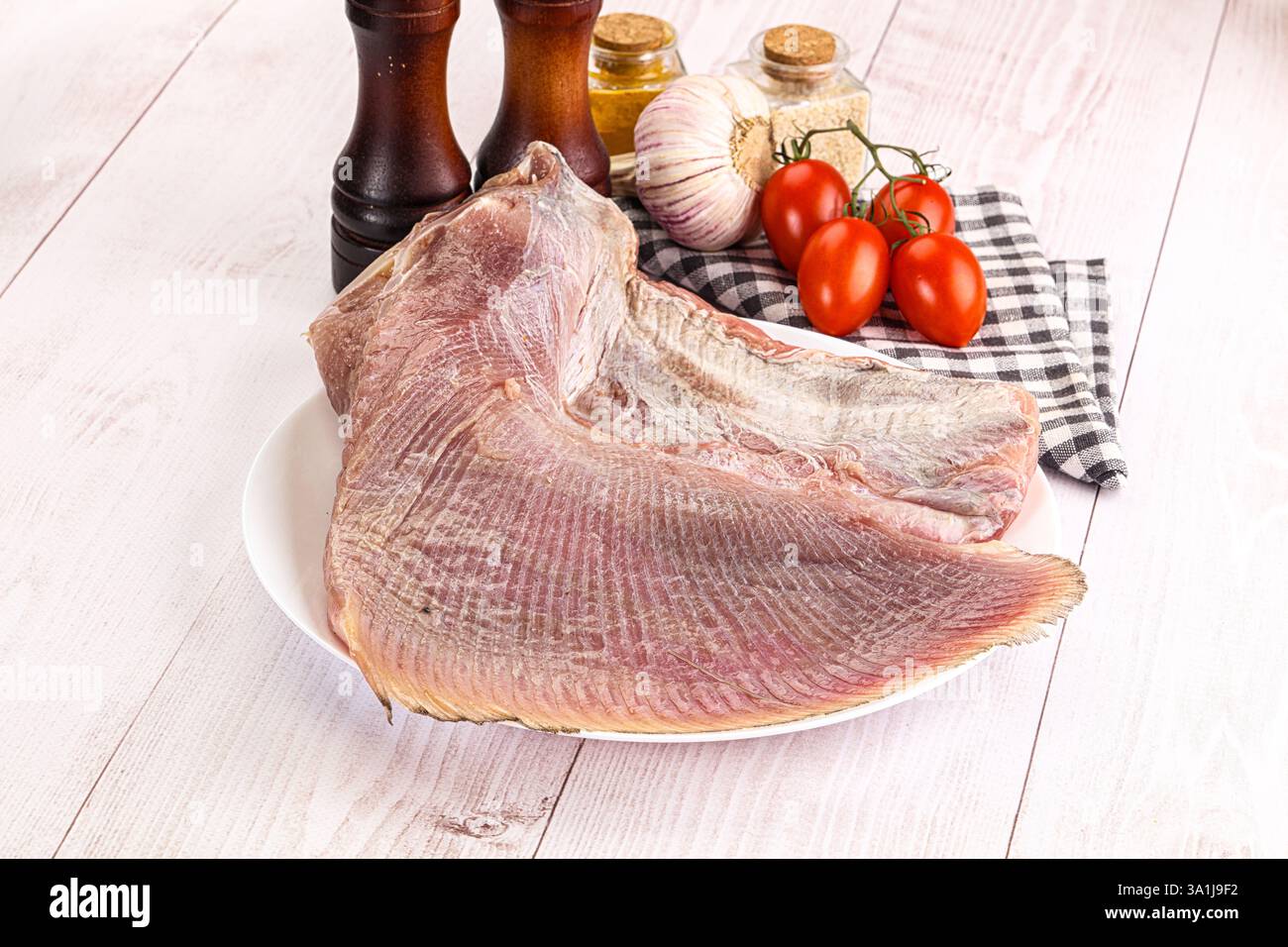 Raw uncooked stingray fish wing in thw plate Stock Photo - Alamy