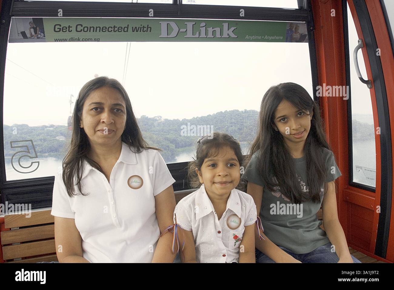 Mother and daughter in cable cars going to sentosa island, Singapore MR ...