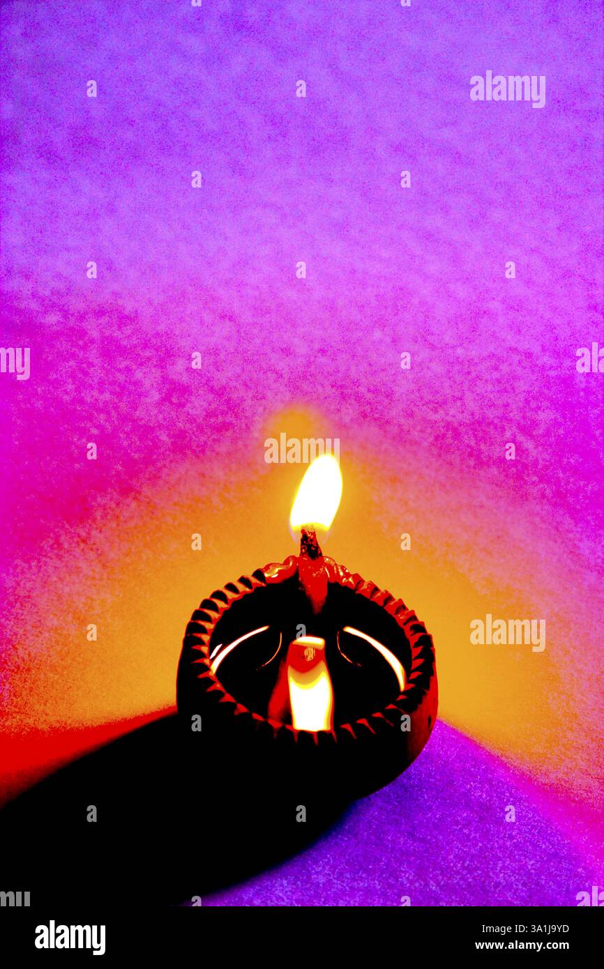 Fine art, single one diya clay oil lamp a source of light as flame on ...