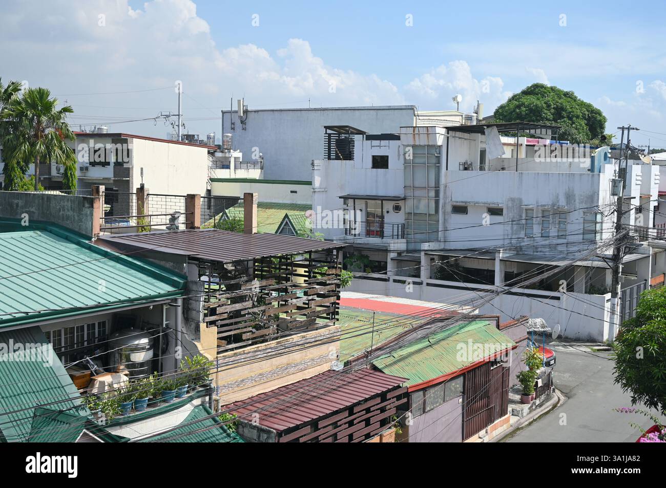 Manila top street view with houses and cars on a sunny day Stock Photo ...