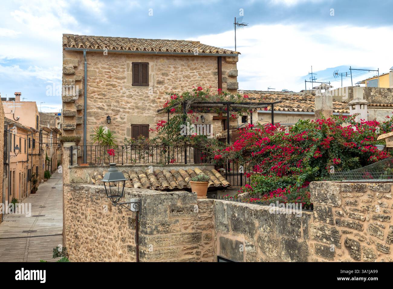 Roof terrace in an alley in the city of Alcudia, Island of Mallorca ...