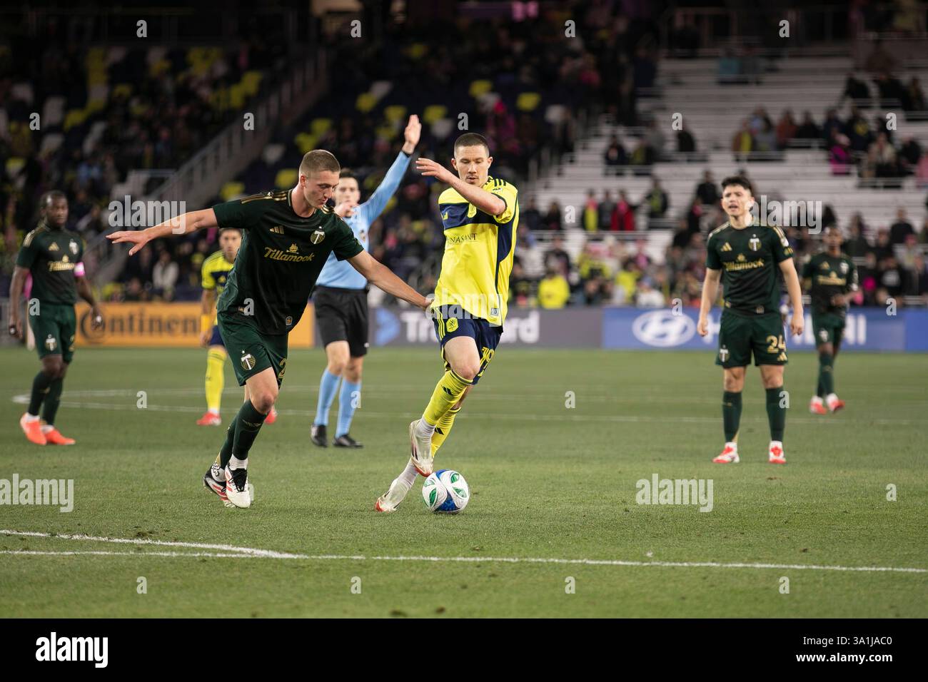 Portland Timbers defender Finn Surman (20) and Nashville SC midfielder ...