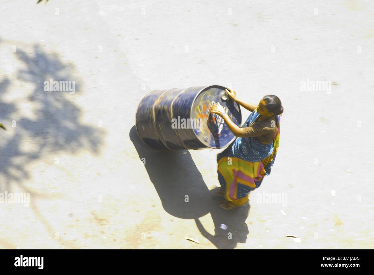 Rural working women rolling drum, Mumbai, Maharashtra, India, Asia ...