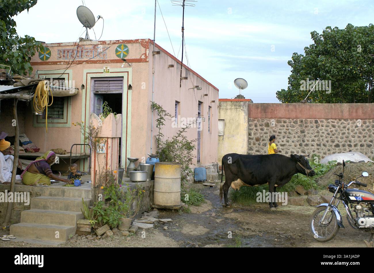 House with a TV dish antenna at Ralegan Siddhi near Pune, Maharashtra ...