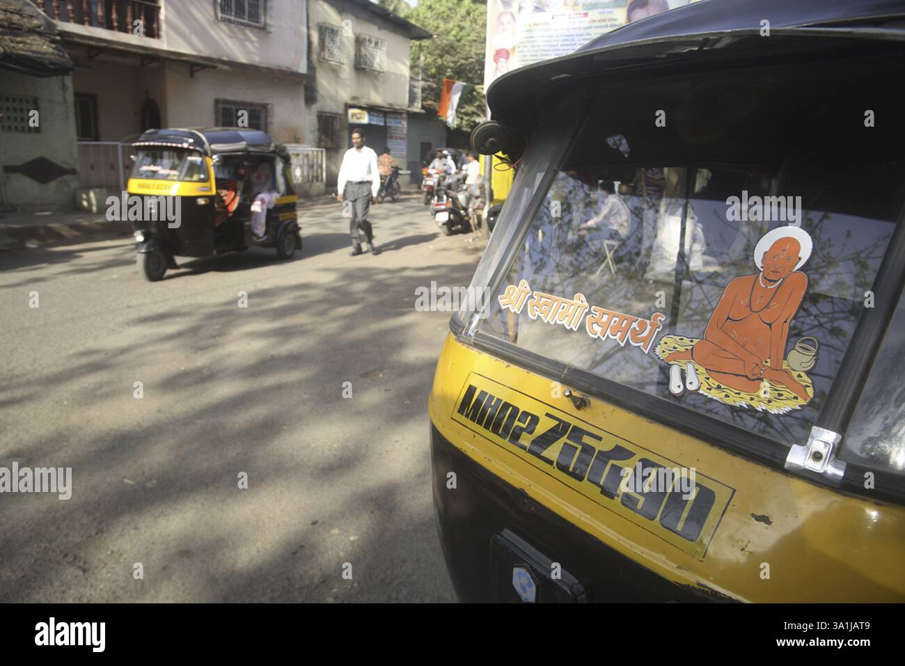 Three wheeler auto rickshaw painted Swami Samarth on windscreen ...
