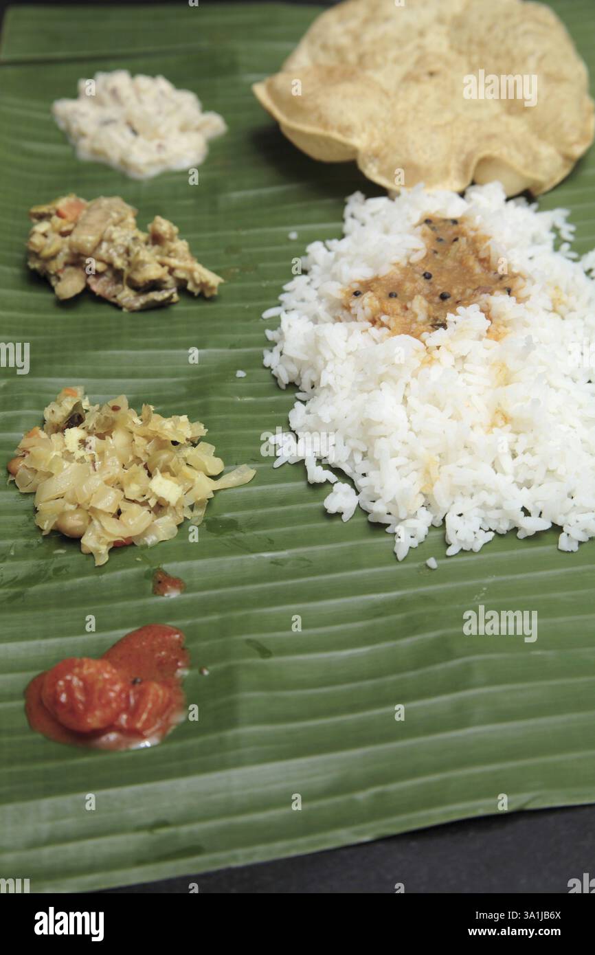 South Indian food served on banana leaf cabbage and mixed vegetable ...