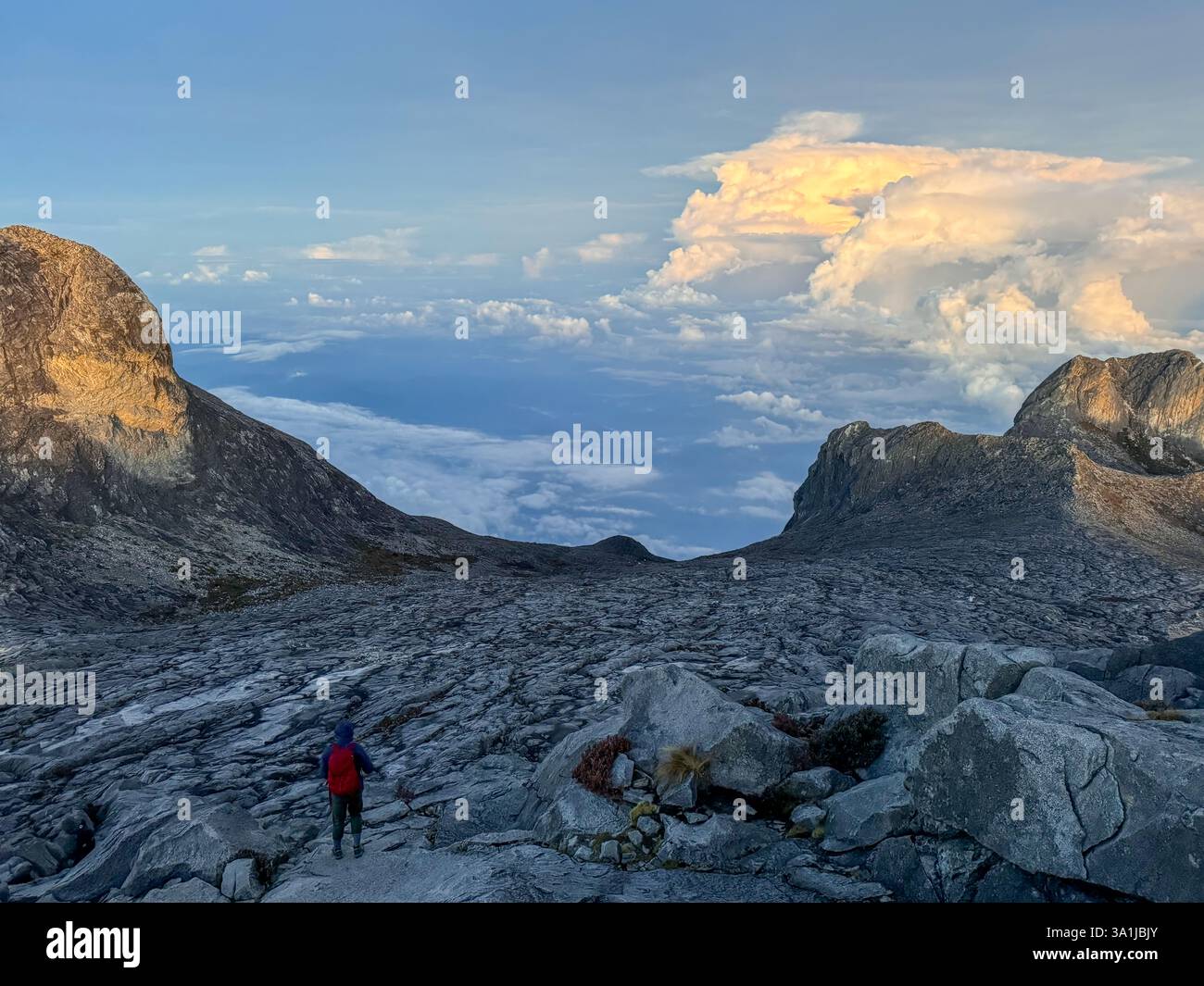 Lone climber atop Mount Kinabalu in Borneo Stock Photo - Alamy