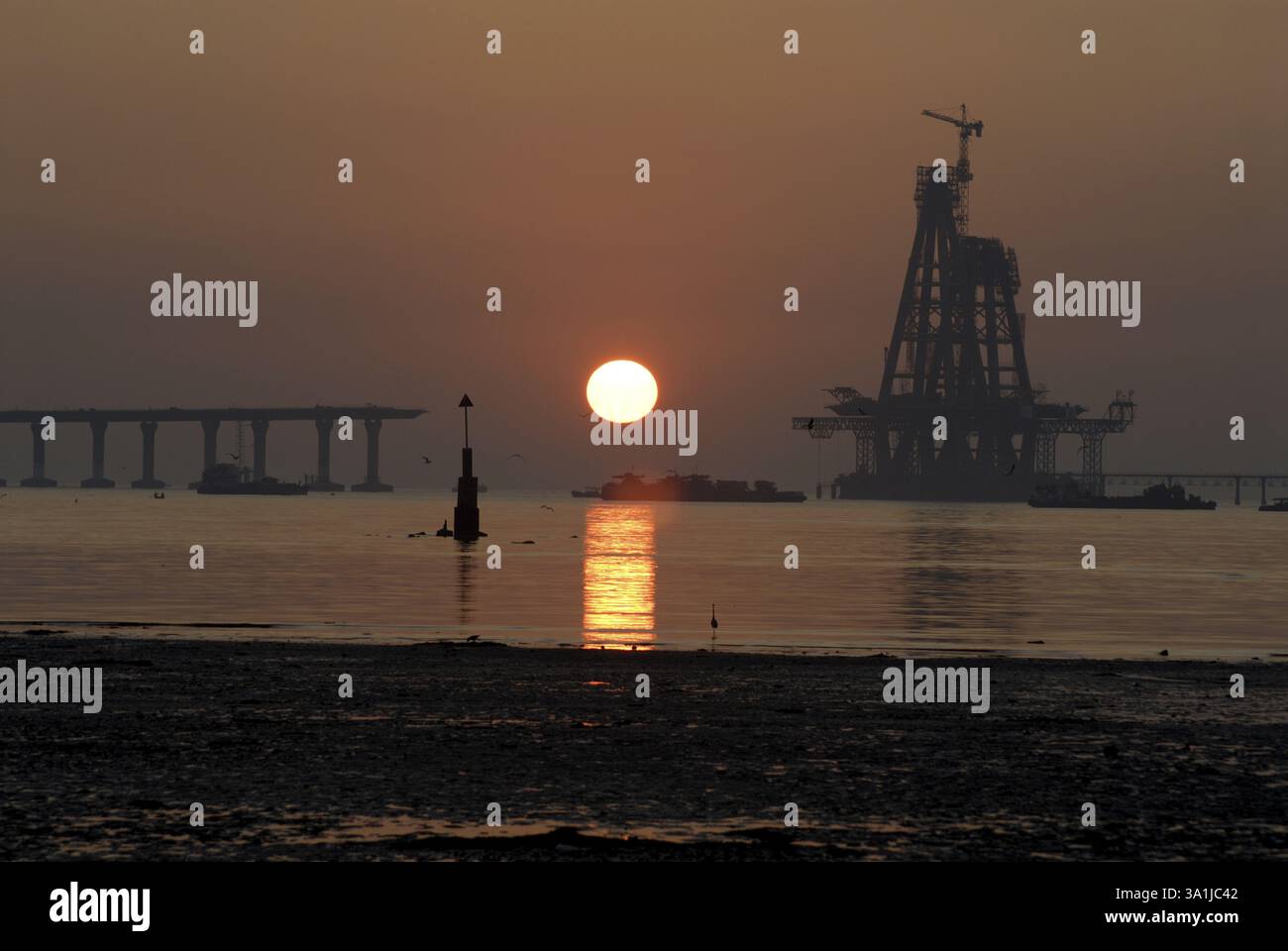 Sunset at Mahim Beach near Worli sea link bridge under construction ...