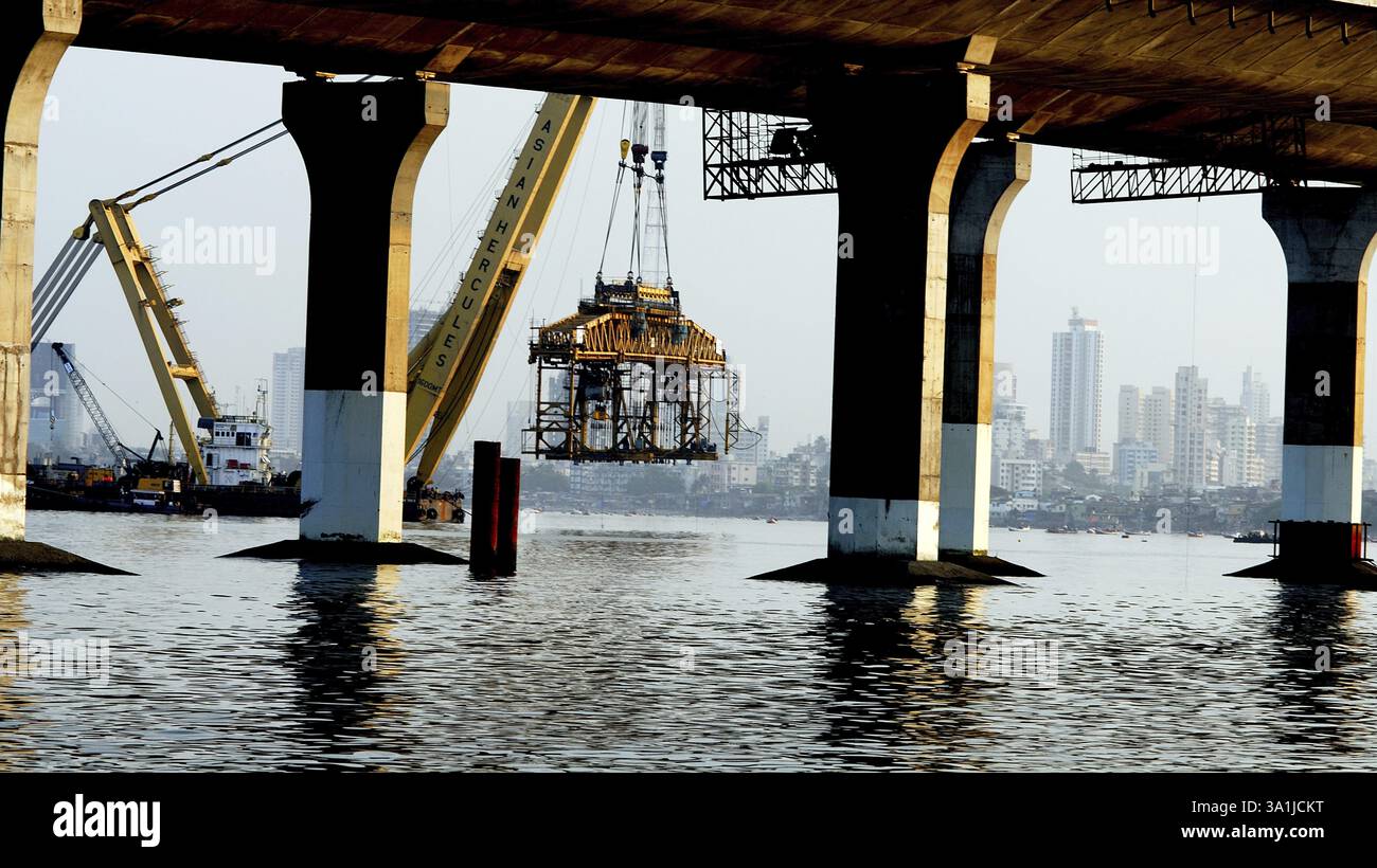 Asian Hercules Crane Carrying Load Looking Through Metal Pillars at ...