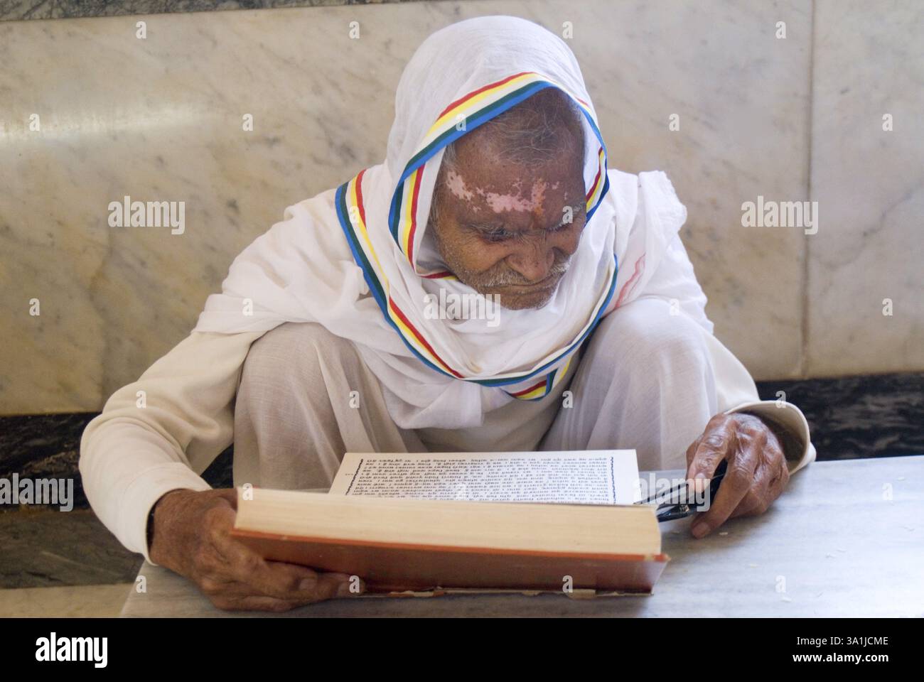 Jain man reading scripture at Parasnath, Jharkhand, India, Asia Stock ...