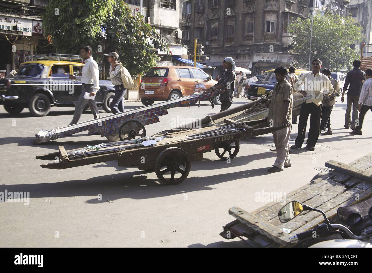 Man pulling hand cart, Sardar Vallabhbhai Patel road, Grant road ...