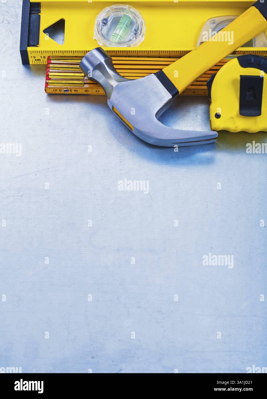 Measuring tape construction level claw hammer wooden meter on metallic ...