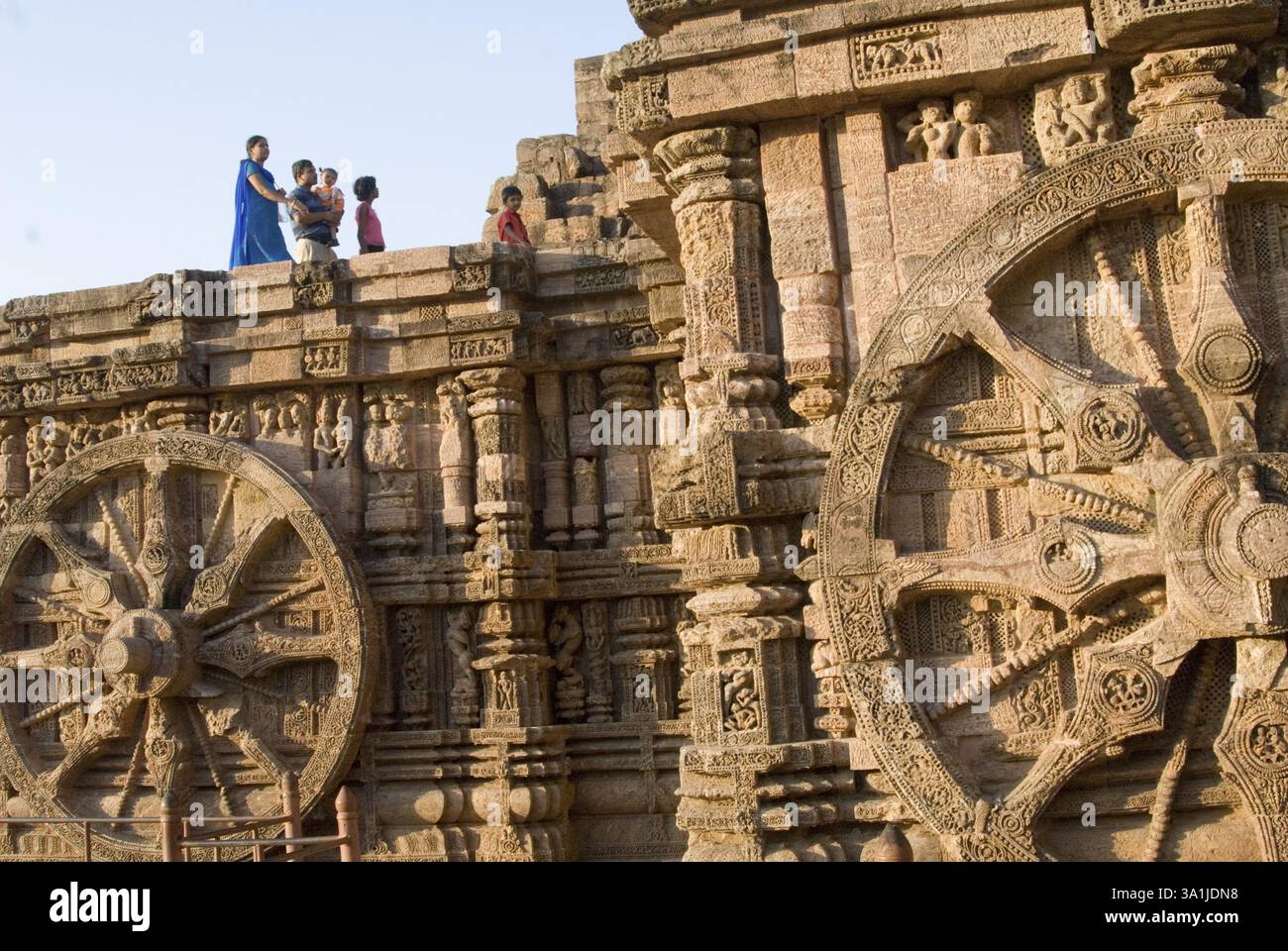 Visitors at World Heritage 13th century Sun temple represent chariot of ...