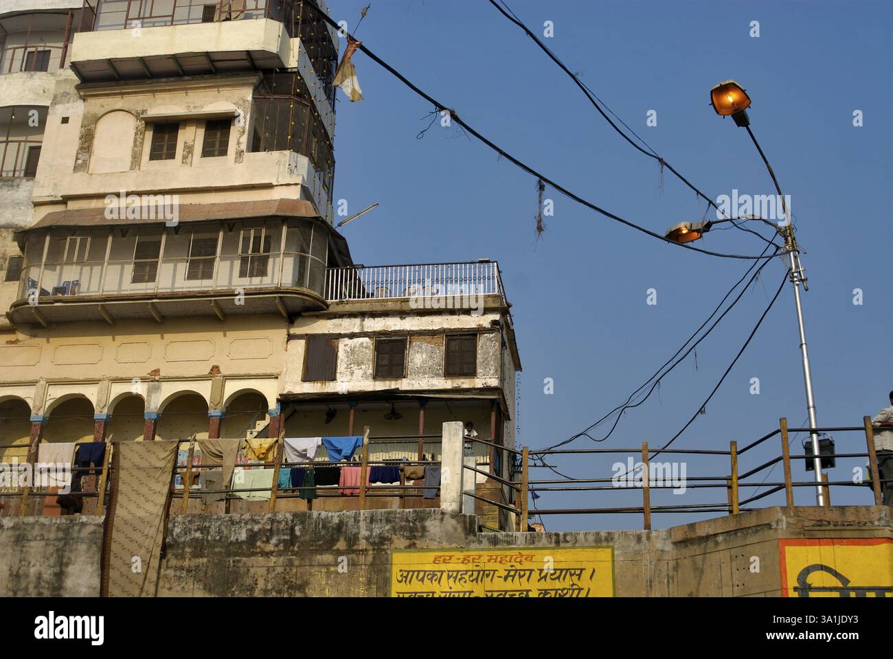 Building with glowing street lamps, Varanasi, Uttar Pradesh, India ...