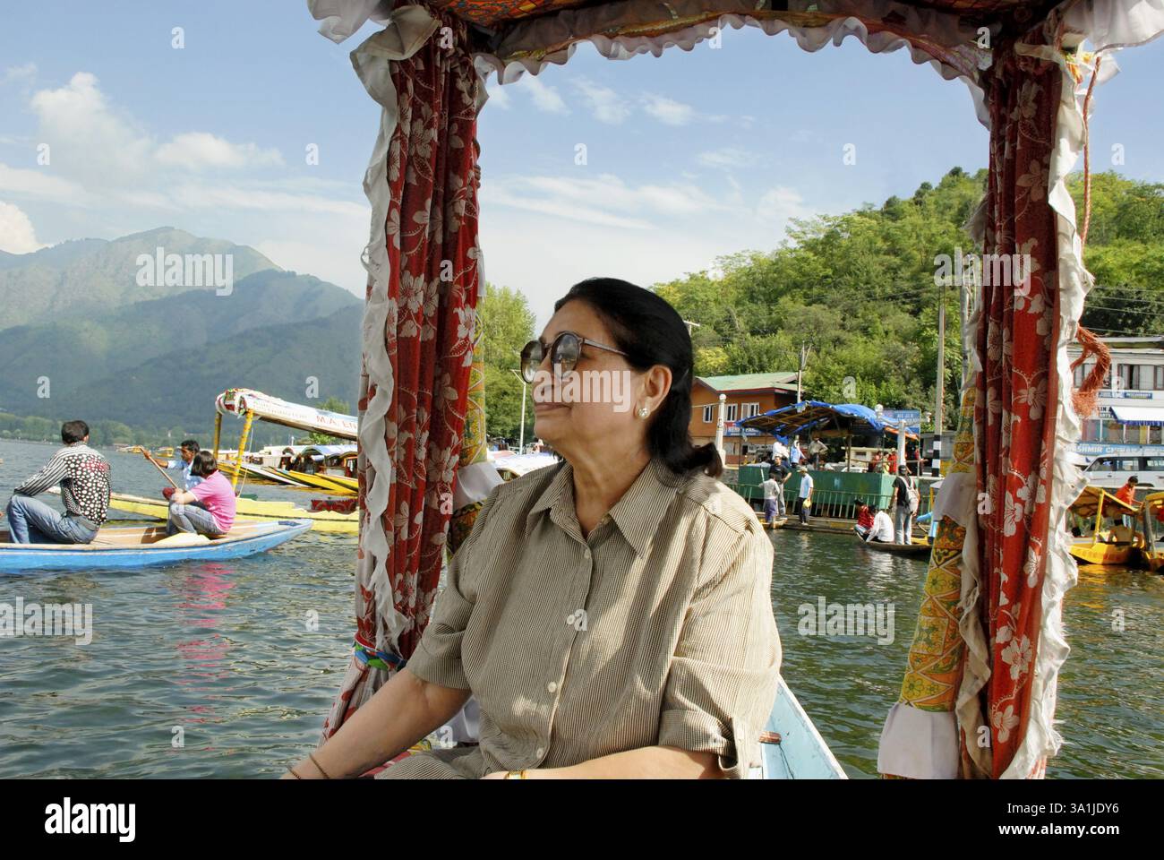 Lady sitting & enjoying in Shikara at Dal lake, Srinagar, Jammu ...