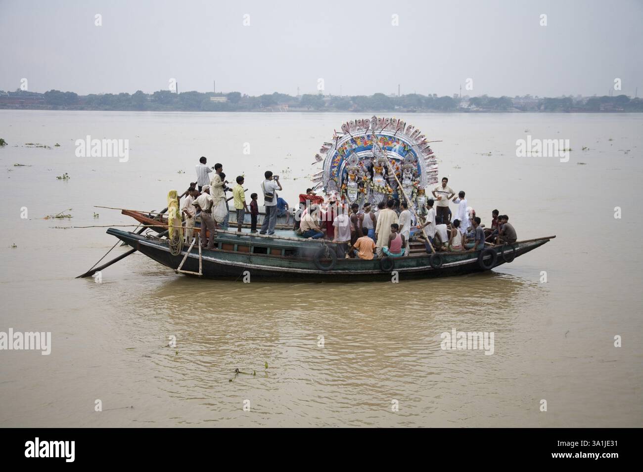 Farewell of the Durga idol visarjan taking in boat in river hooghly on ...