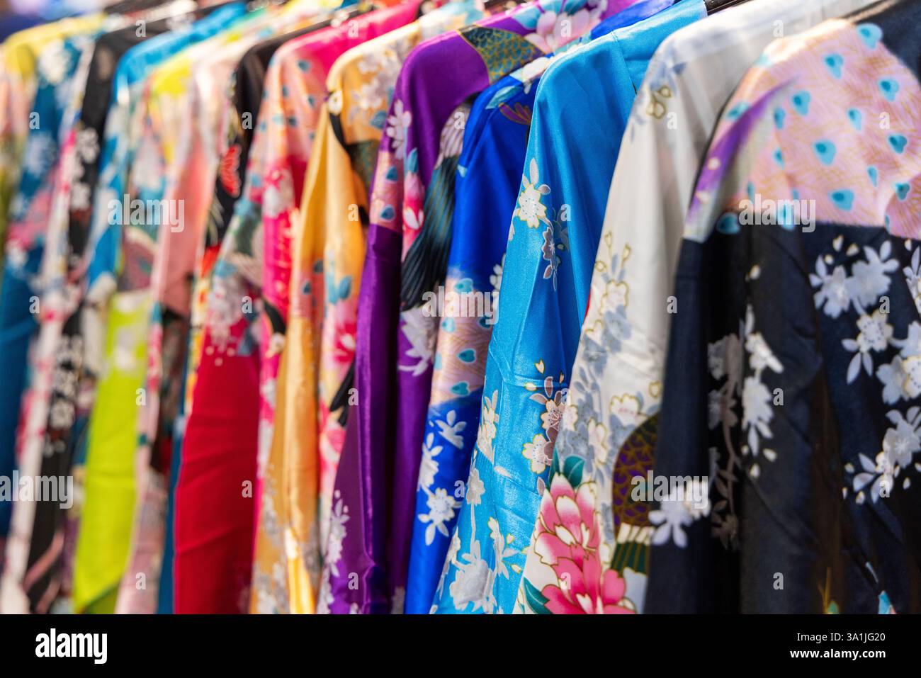 Traditional Japanese kimonos with floral patterns and vibrant colors ...