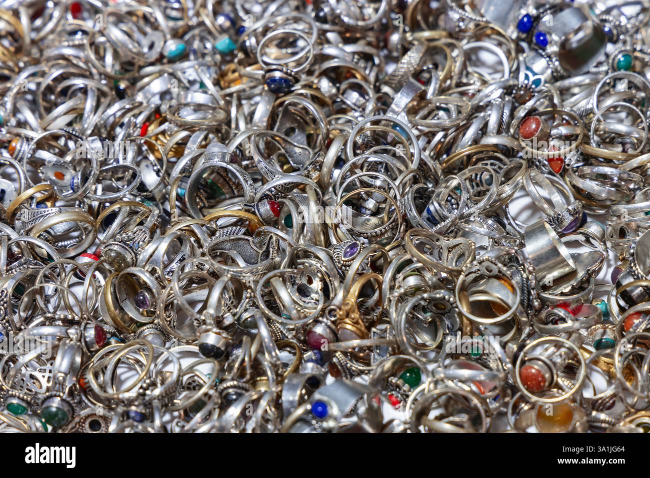 Pile of Indian rings made of silver and brass with intricate carvings ...